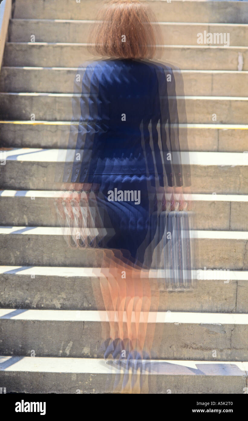 Woman climbing stairs office hi-res stock photography and images - Alamy