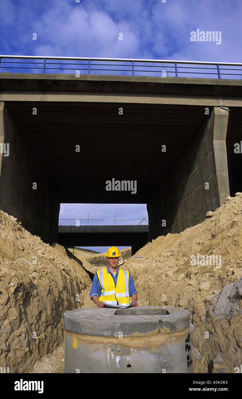 surveyor on site of road bridge construction on motorway yorkshire uk ...