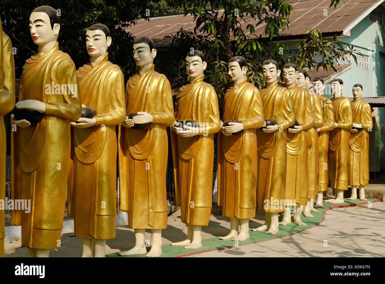 Statues of monks in a monastery, Yangon, Myanmar Stock Photo - Alamy