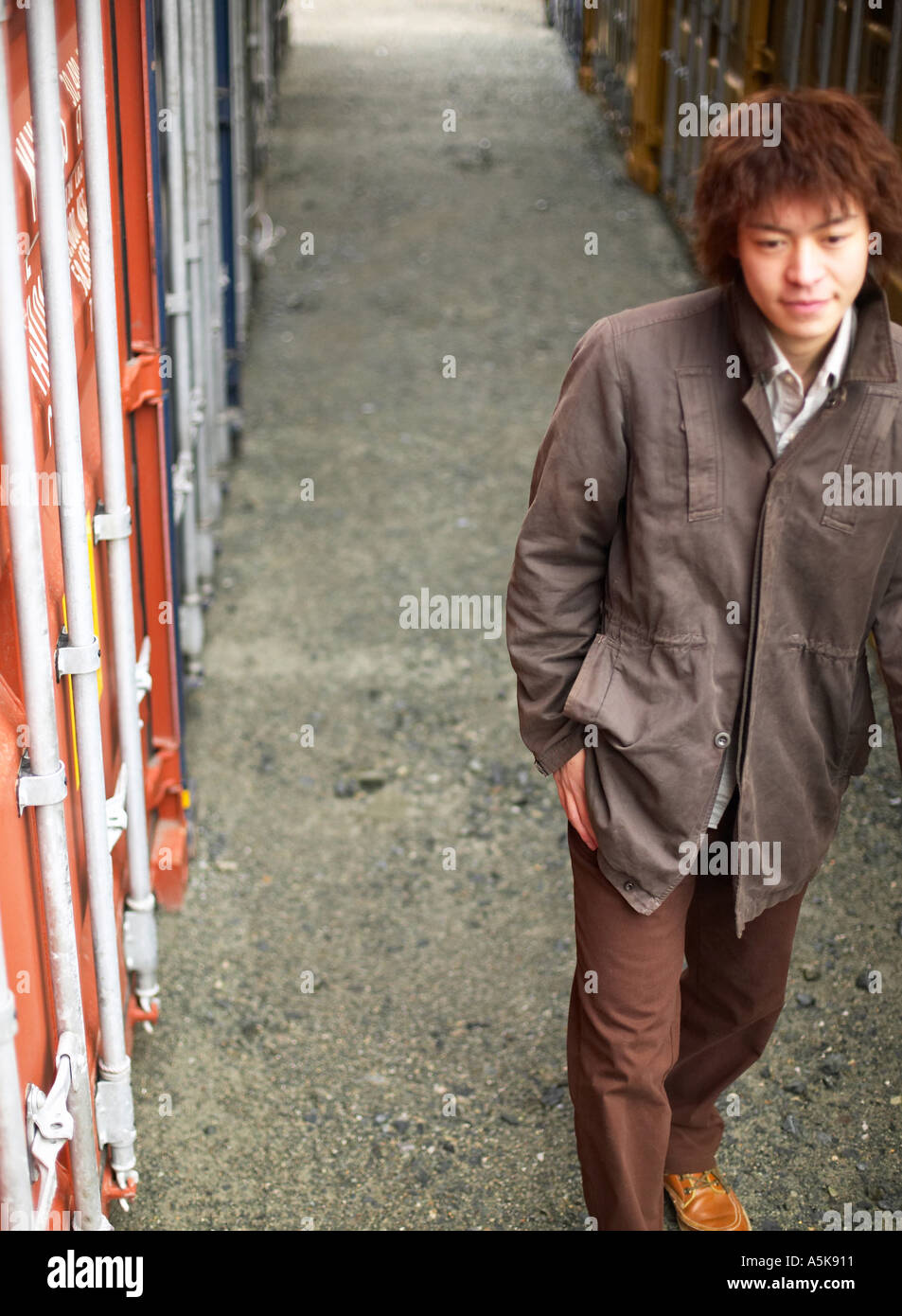 Young man walking Stock Photo - Alamy