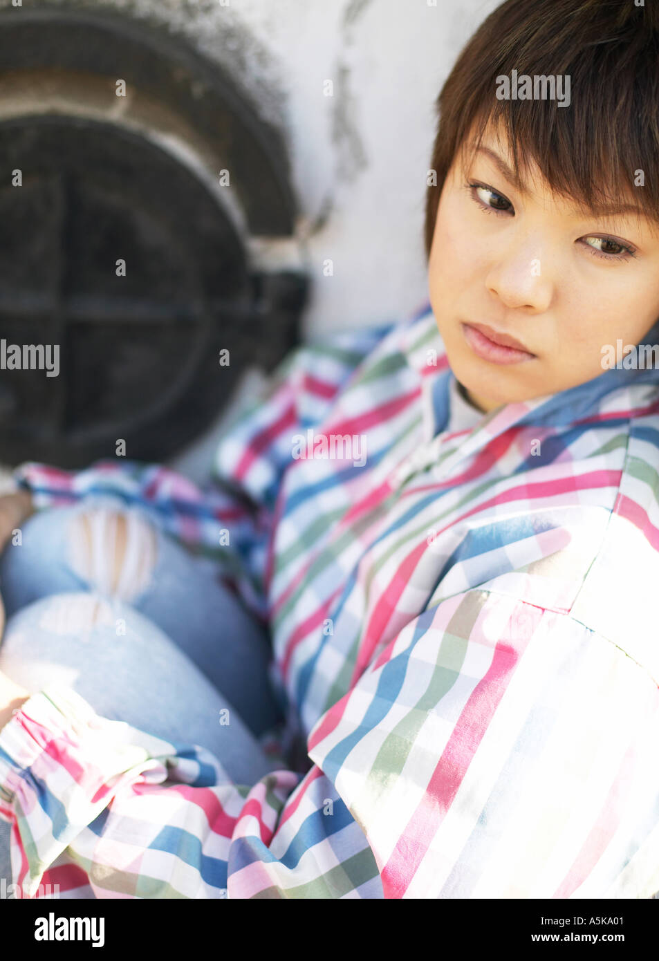 Young asian woman legs folded hi-res stock photography and images - Alamy