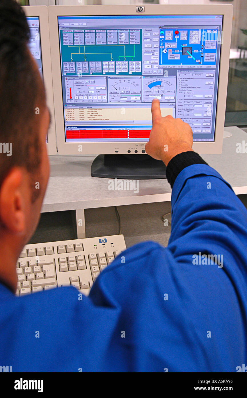 A Scientist is reading Data off a Monitor Screen Stock Photo - Alamy