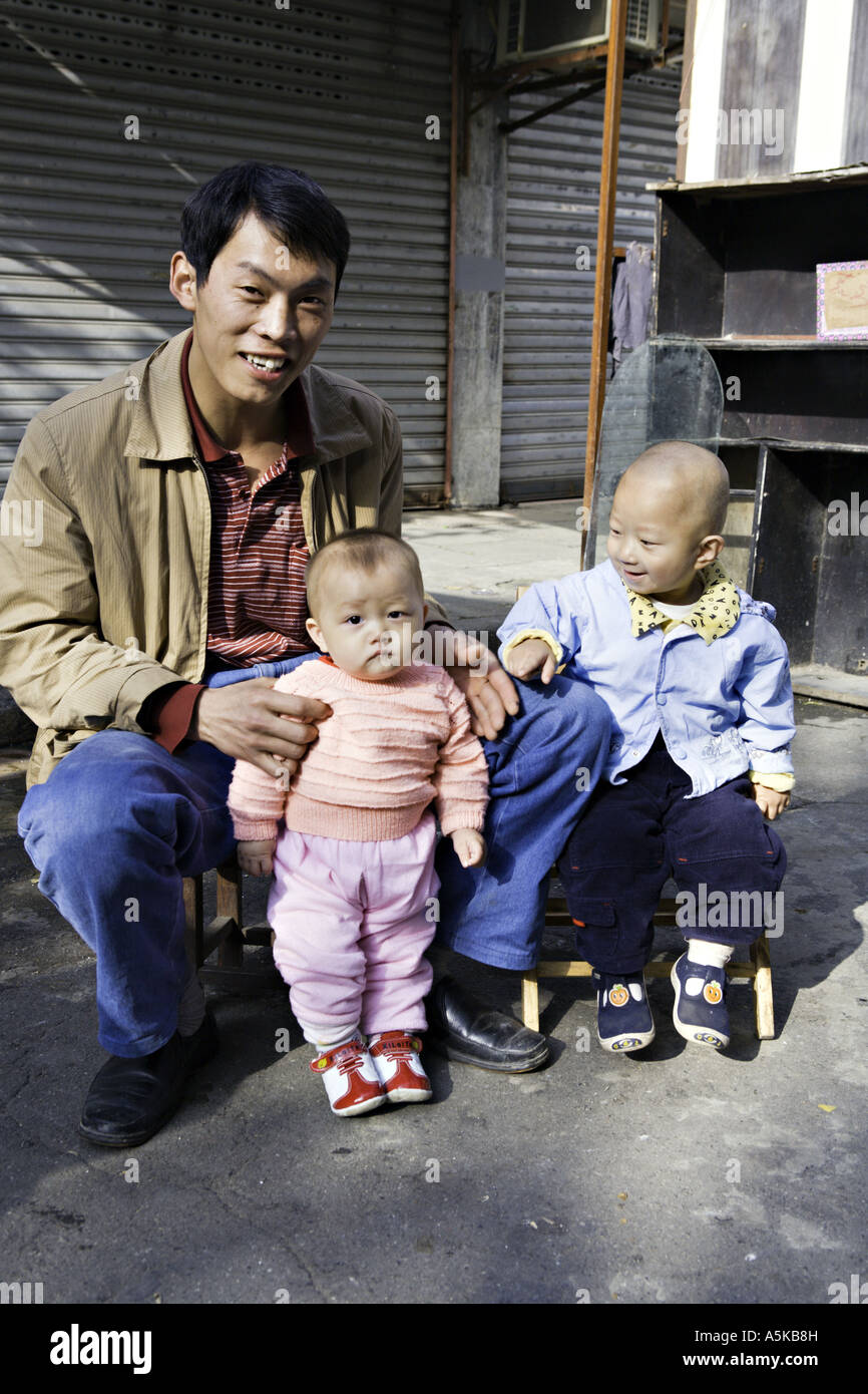 CHINA SHANGHAI Chinese father taking care of his baby daughter and ...