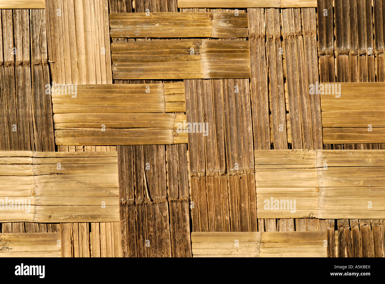 Woven bamboo mat as exterior wall of a house, Katchin State, Myanmar ...