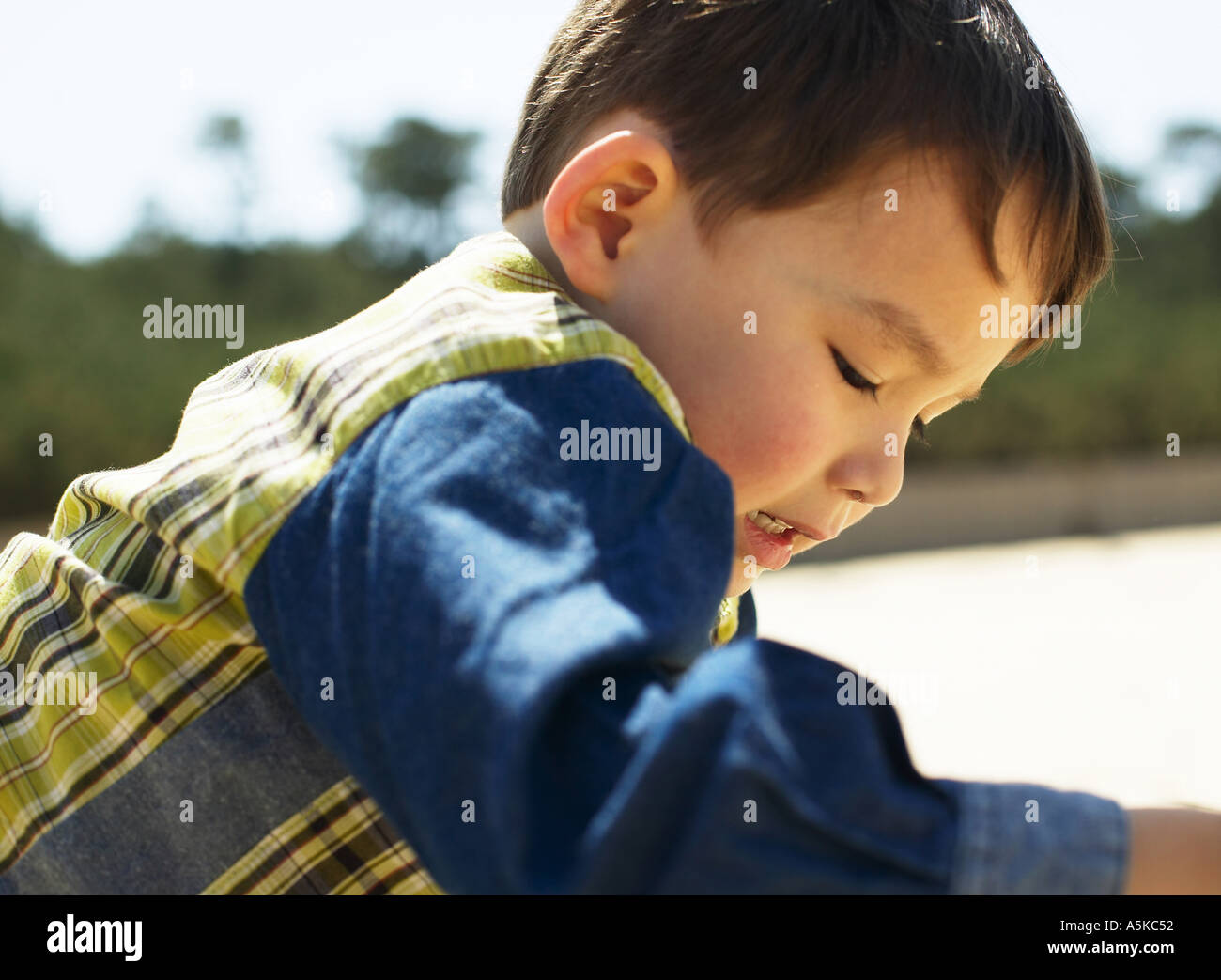 Boy leaning forward hi-res stock photography and images - Alamy