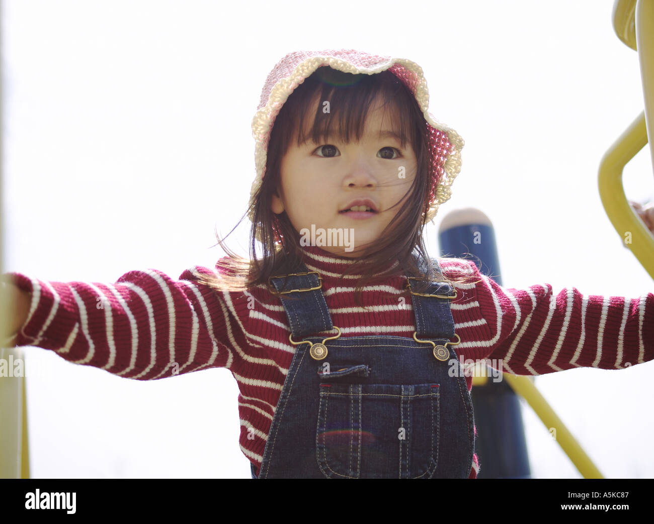 Young girl standing looking Stock Photo - Alamy