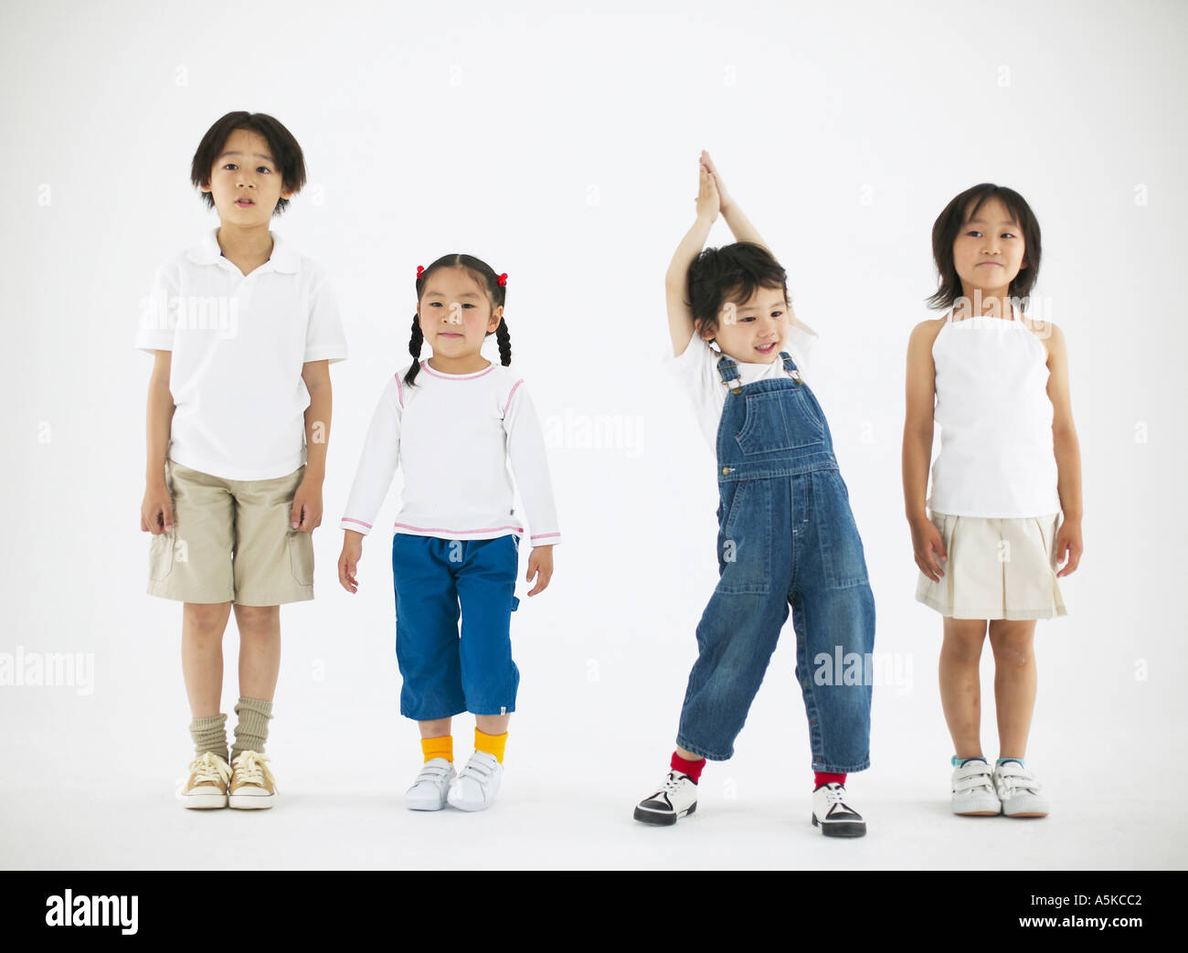 Young children posing Stock Photo - Alamy
