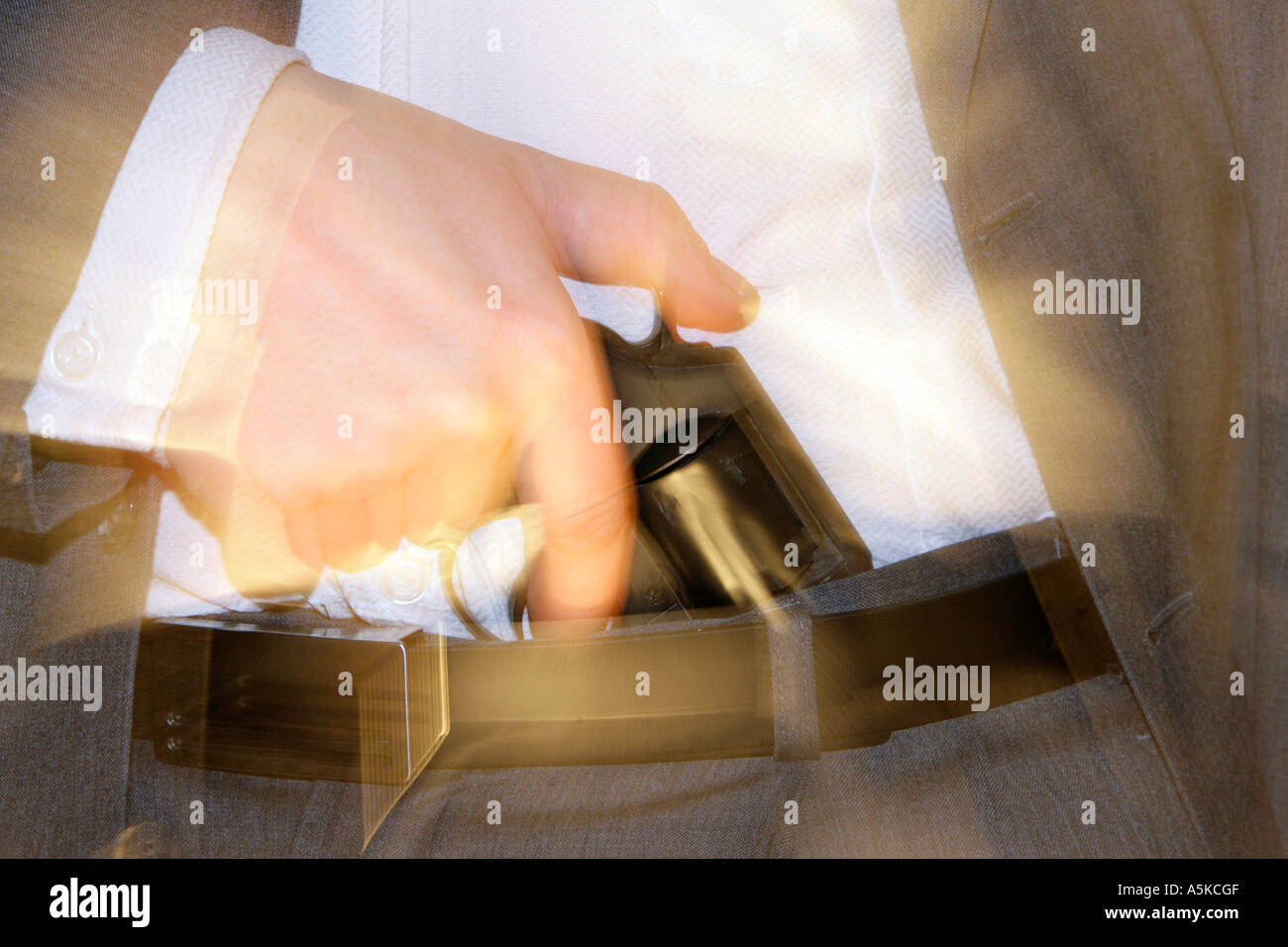 Killer pulls a gun very fast Stock Photo - Alamy