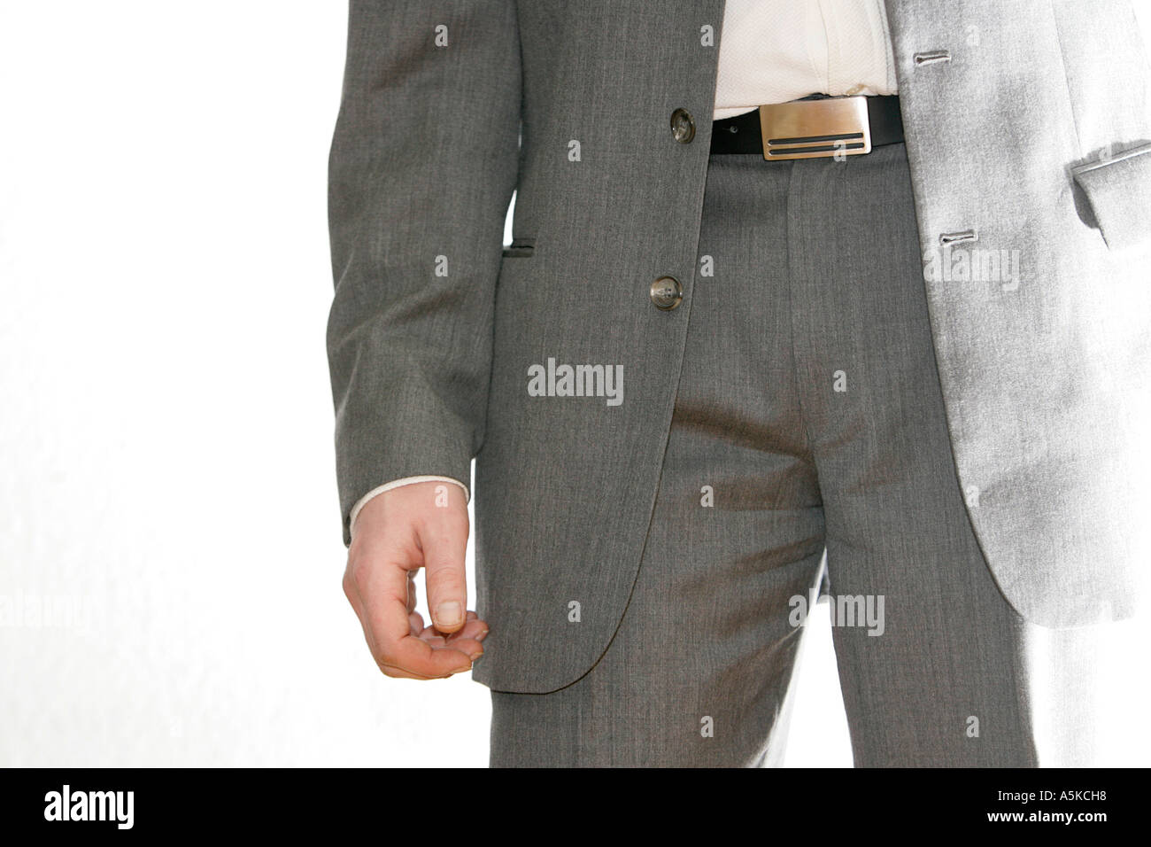 Business man in suit stands still Stock Photo - Alamy