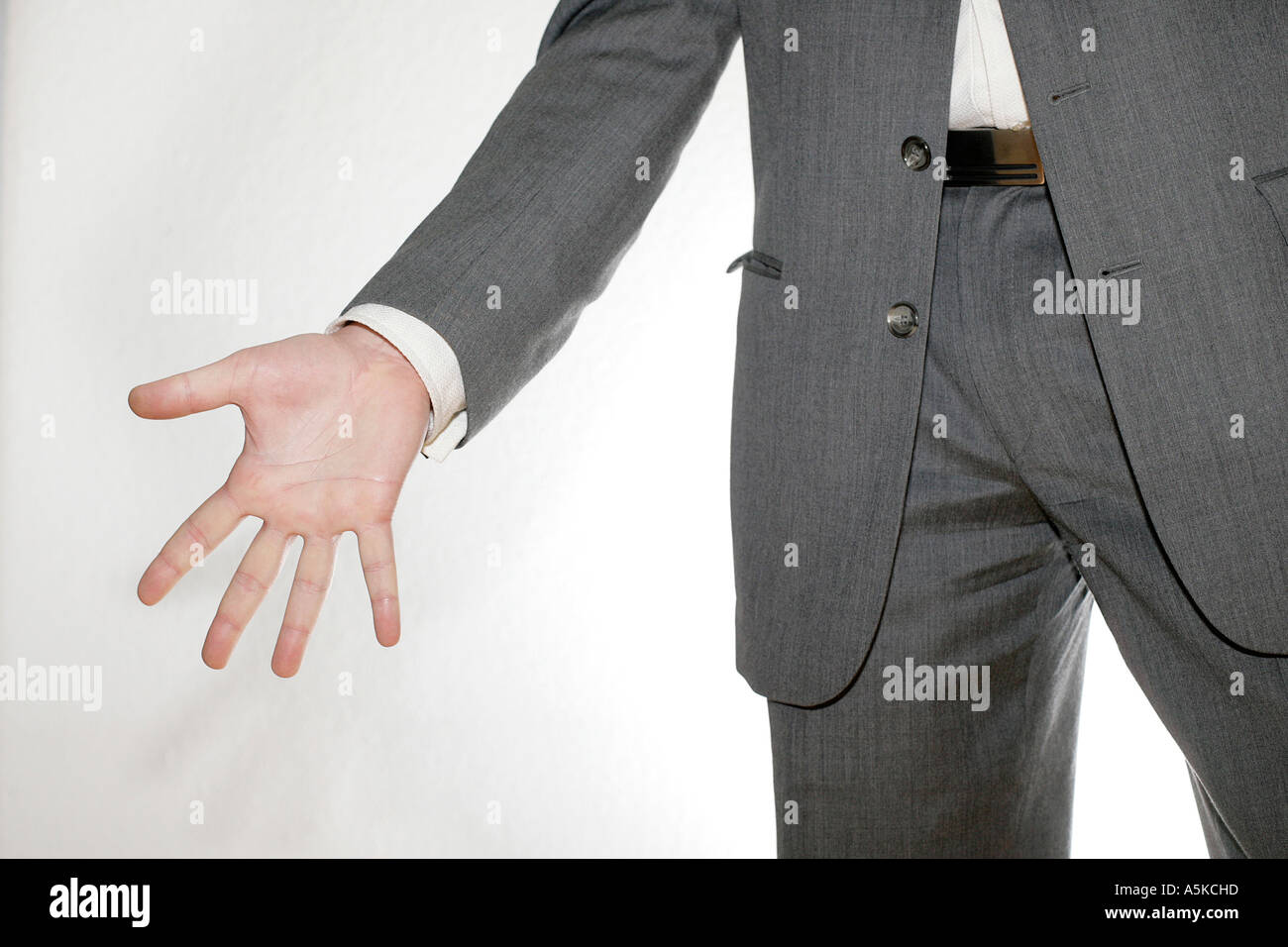 Business man shows his big hand Stock Photo - Alamy