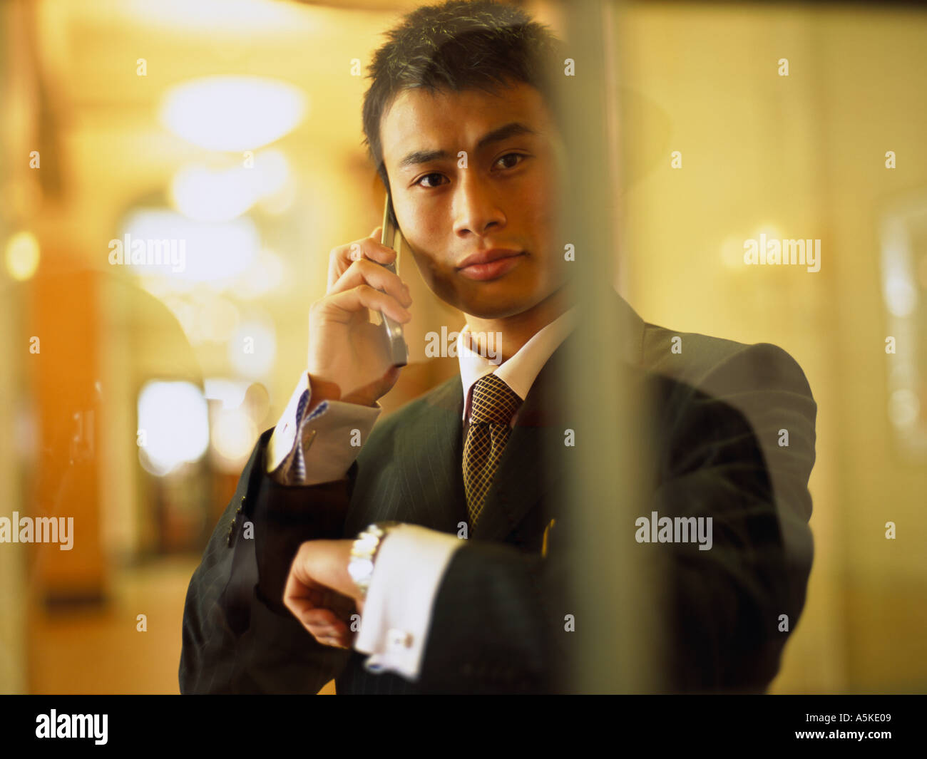 Japanese man checking phone hi-res stock photography and images - Alamy