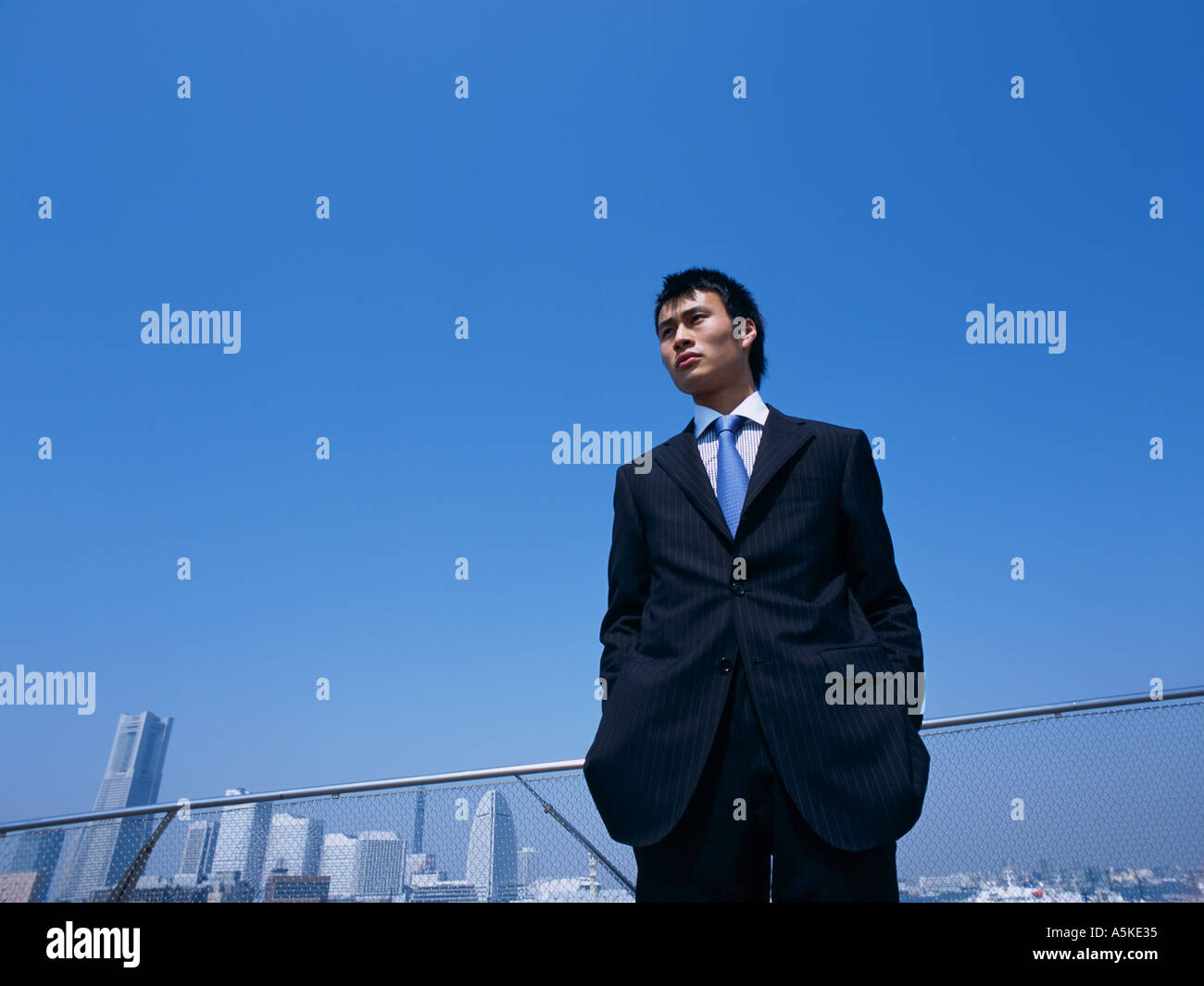 Asian man standing Stock Photo - Alamy