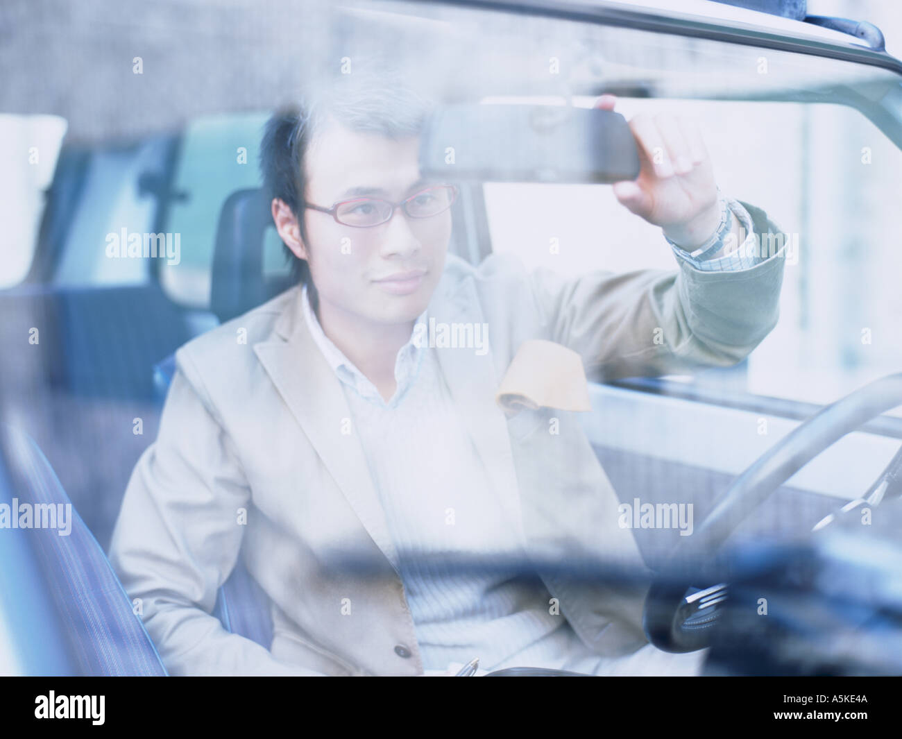Well dressed man looking in mirror hi-res stock photography and images ...