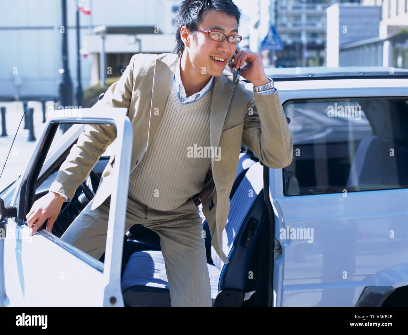 Suit black car exiting hi-res stock photography and images - Alamy