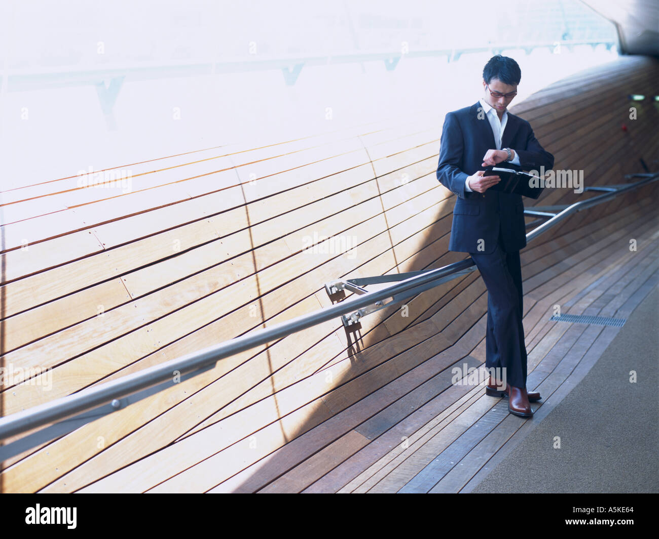 Man waiting in a corridor Stock Photo - Alamy