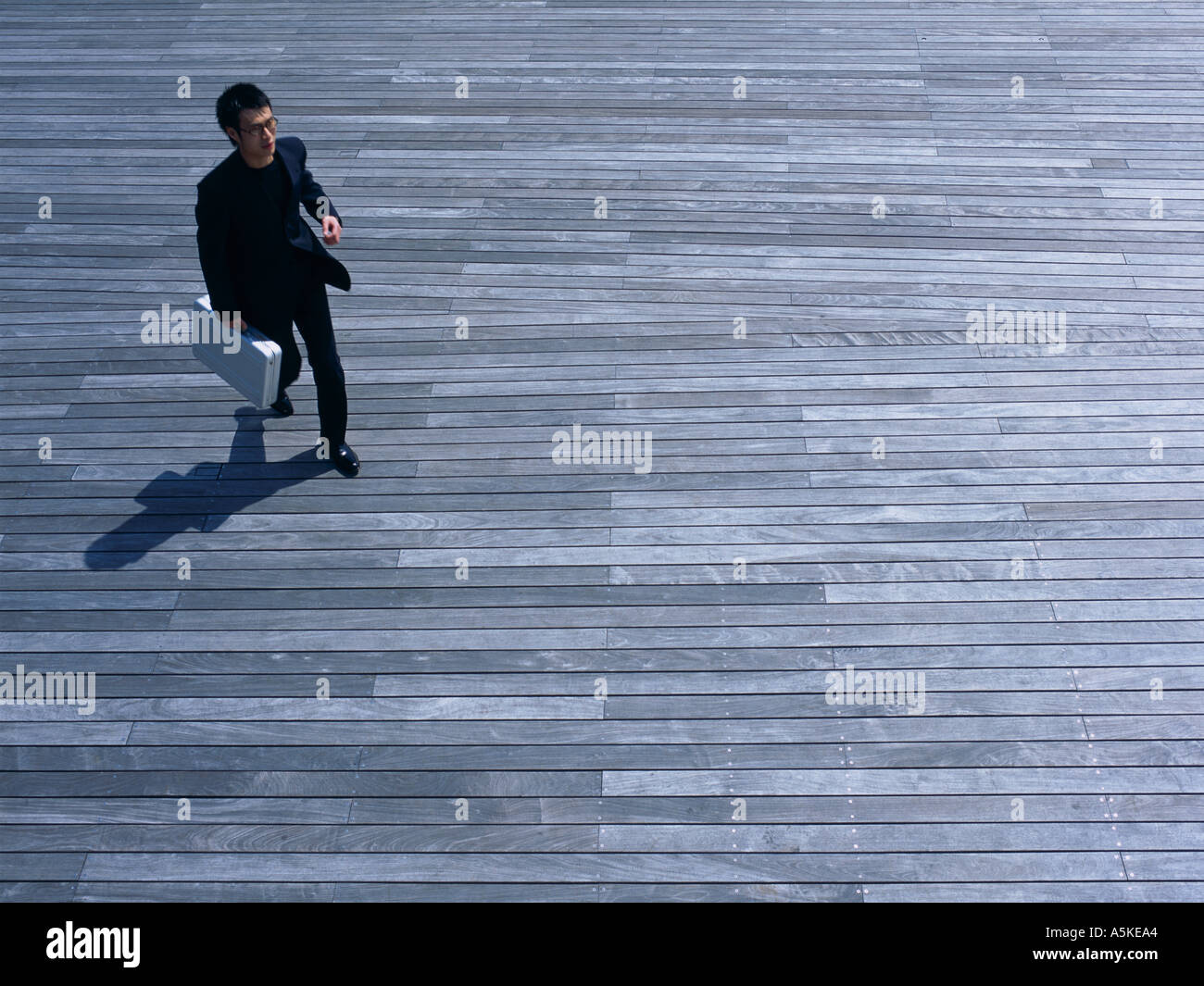 Aerial view of a man walking on a bridge Stock Photo - Alamy