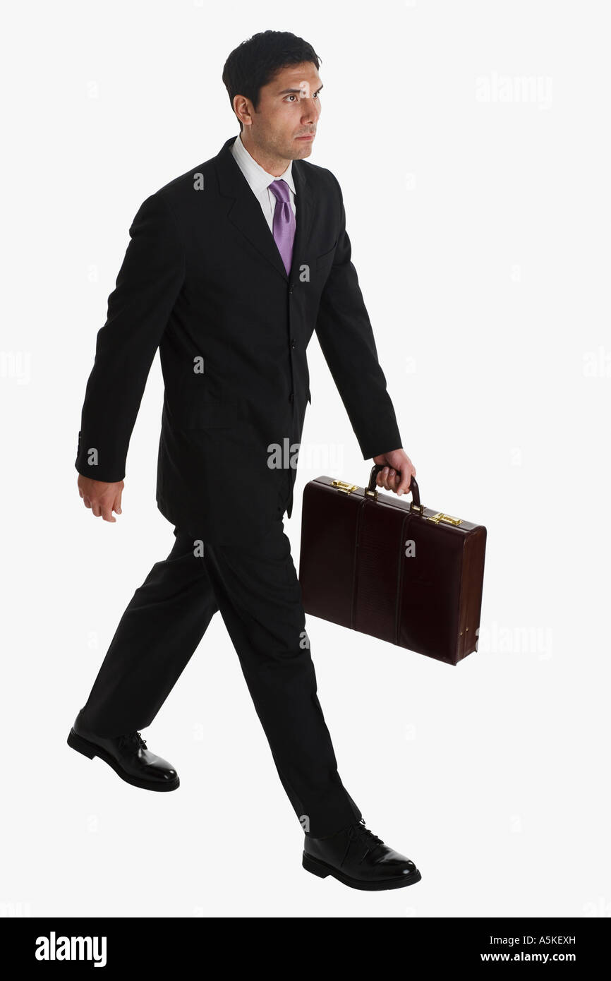 Businessman carrying briefcase Stock Photo - Alamy Businessman carrying briefcase Stock Photo - Alamy