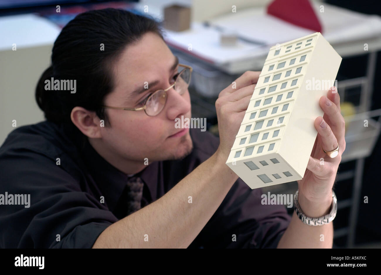 An Architect builds a model for a building project Stock Photo - Alamy