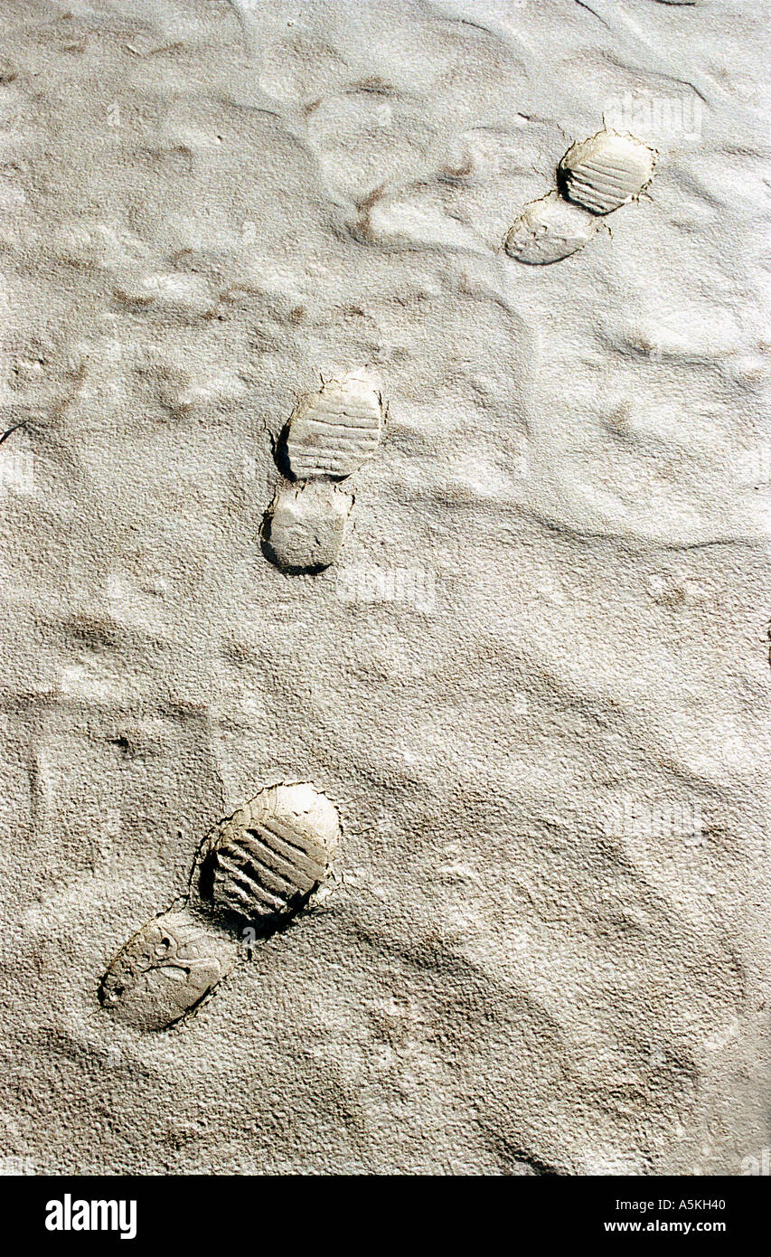 three footsteps in sand mud Stock Photo - Alamy