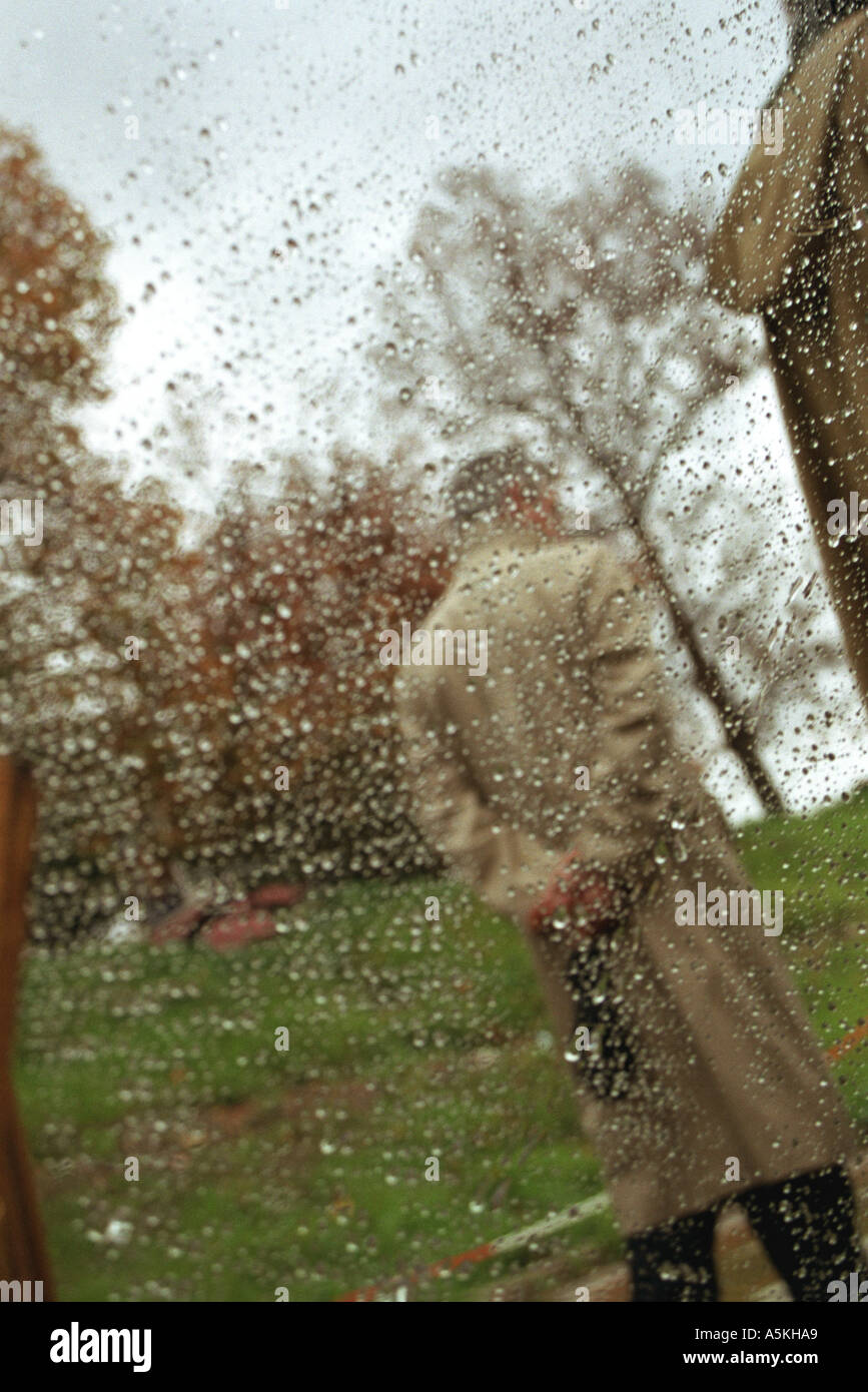 raindrops on mirror window with man and countryside abstract Stock ...
