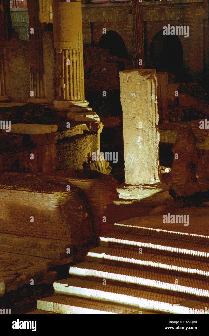 largo argentina sacred area ruins lit at night rome Stock Photo - Alamy