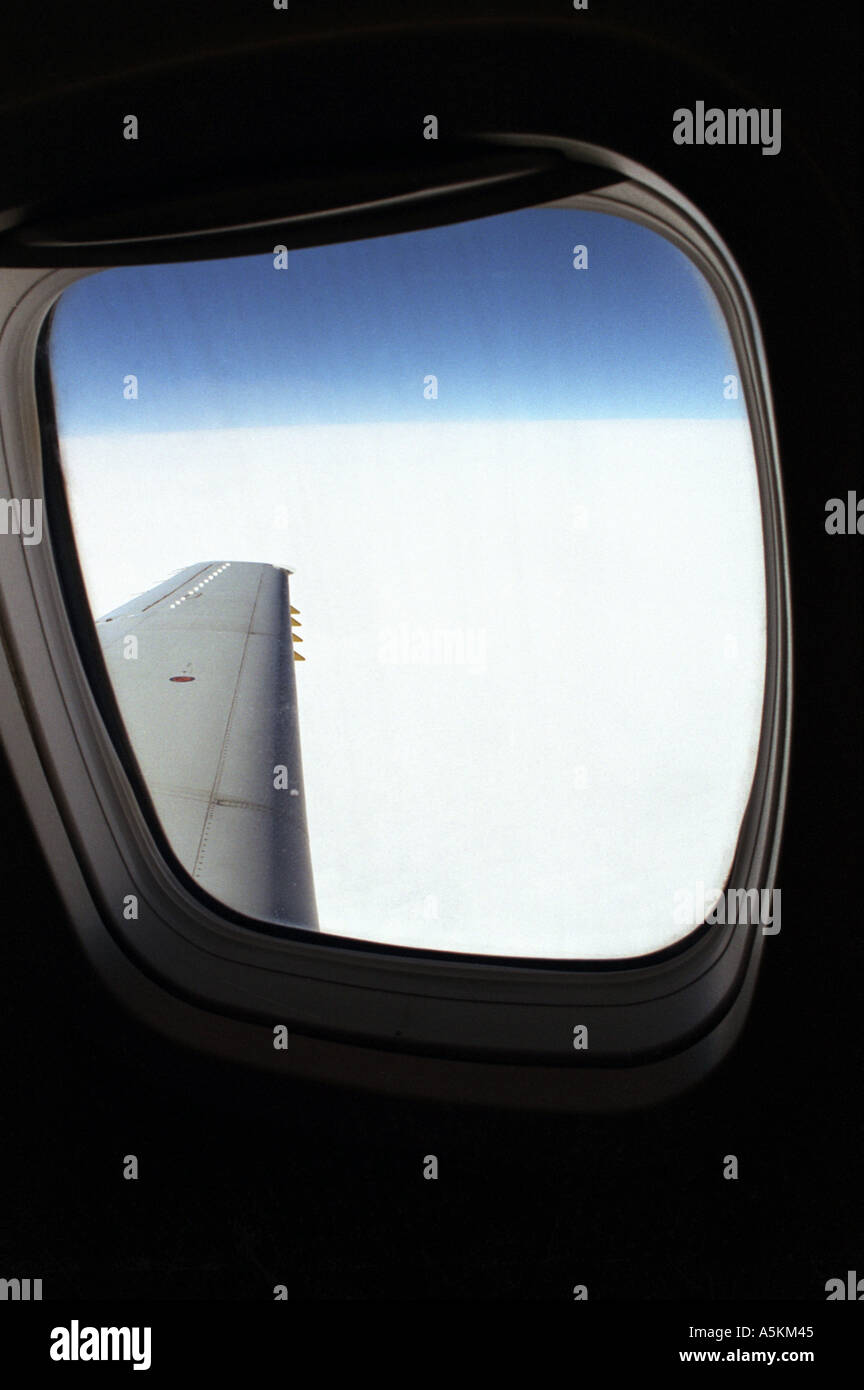 view of wing and sky from plane window Stock Photo - Alamy