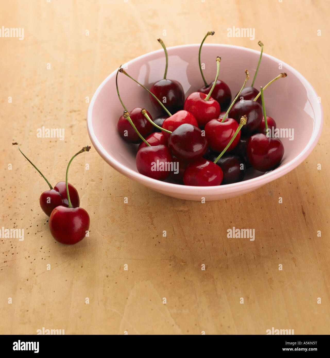 Close up of cherries in bowl Stock Photo - Alamy