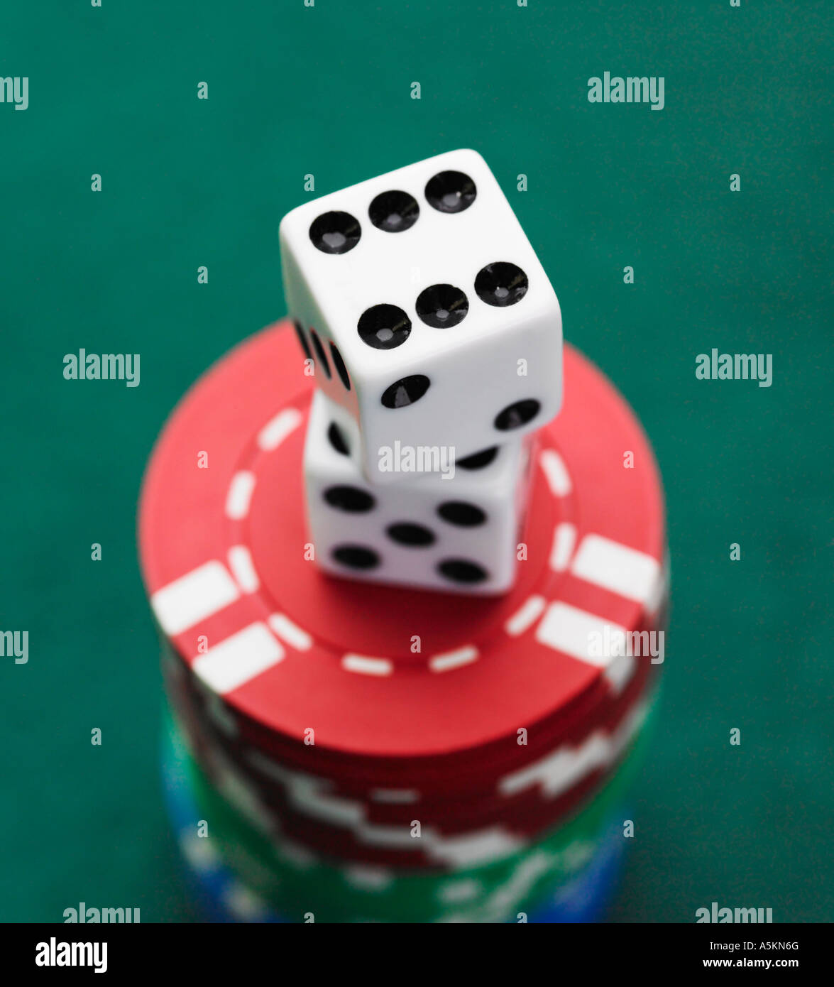 Close up of dice on stack of poker chips Stock Photo - Alamy