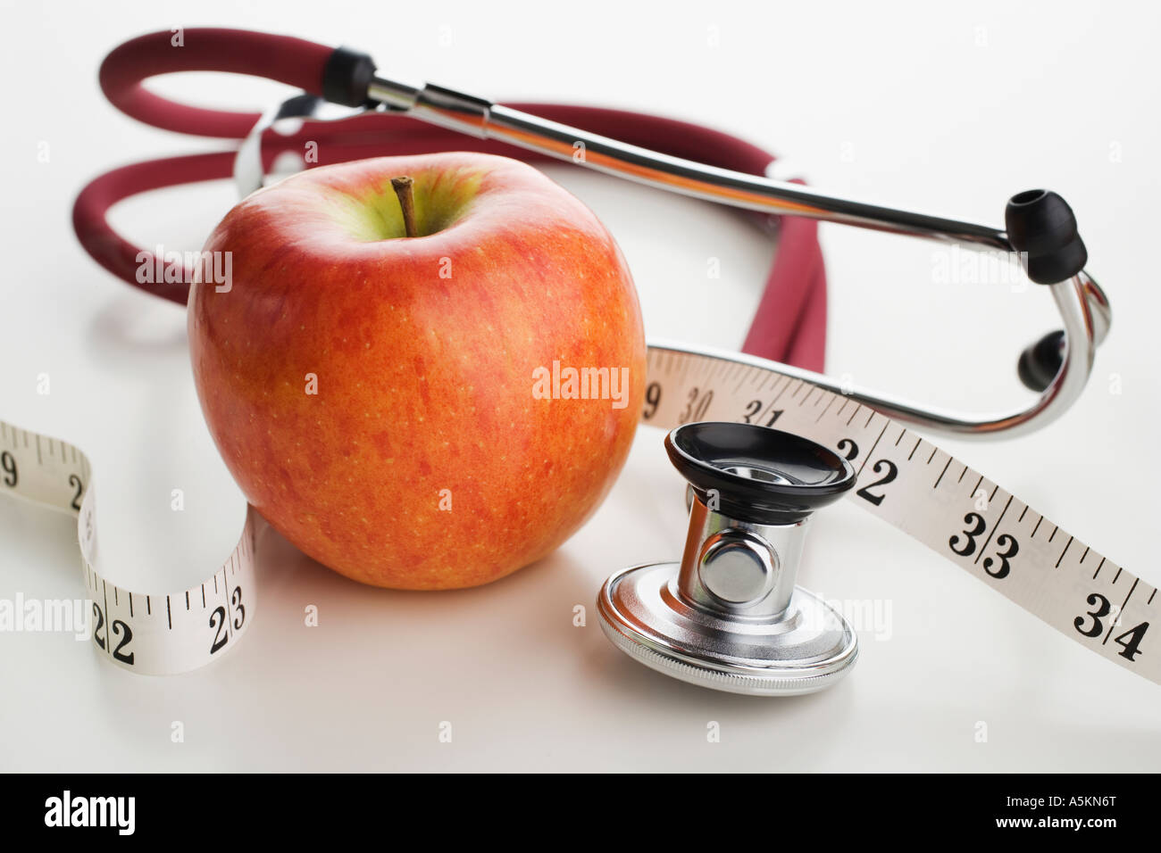 Close up of apple tape measure and stethoscope Stock Photo - Alamy