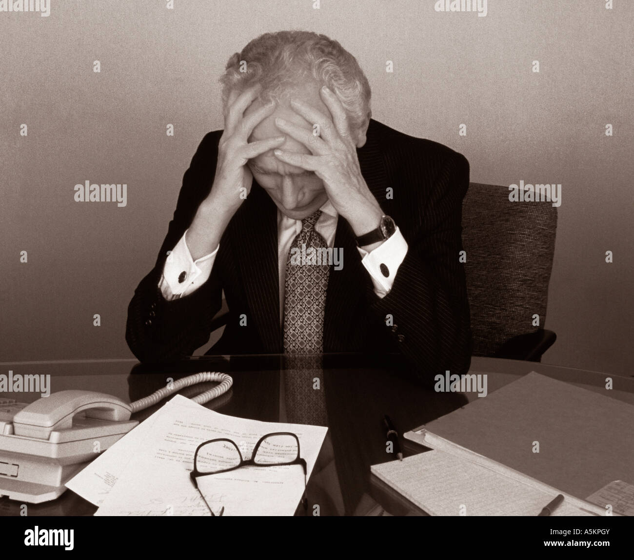 Elderly Man in Office Sitting At His Desk Worried and Tired Overworked ...