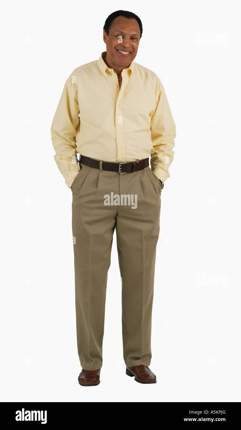 Studio shot of man with hands in pockets Stock Photo - Alamy