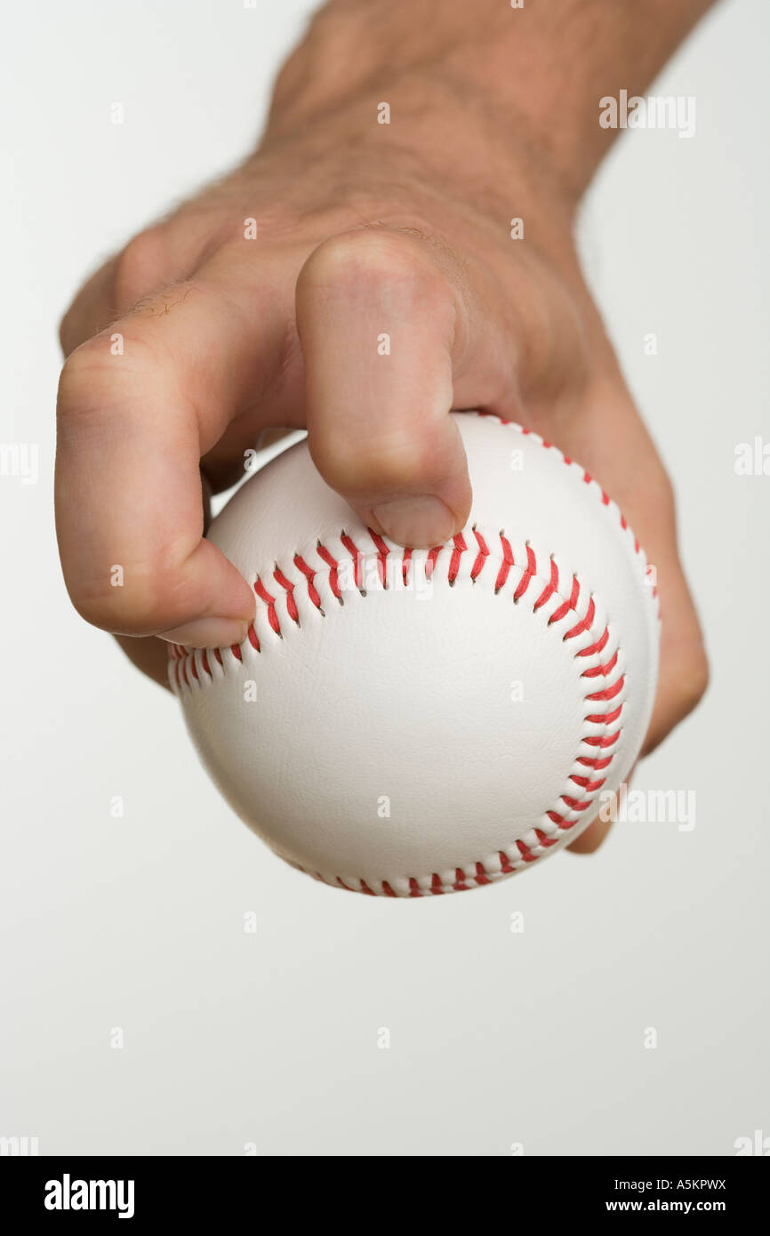 Close up of pitcher holding baseball Stock Photo - Alamy