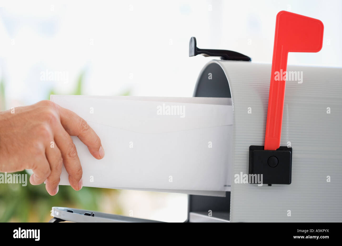 Putting mail in mailbox hi-res stock photography and images - Alamy
