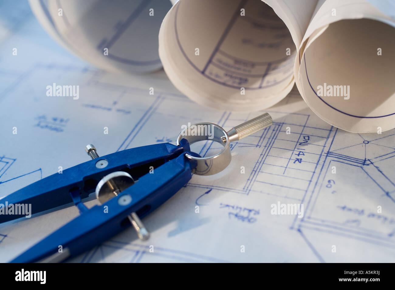 Close up of compass on blueprints Stock Photo - Alamy