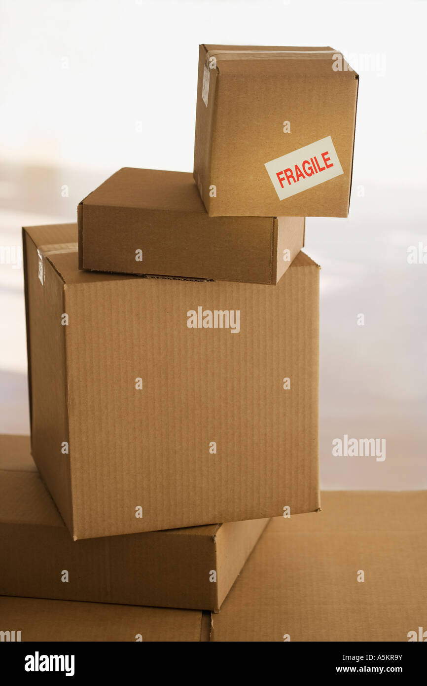Shipping box with fragile sticker on top of stack Stock Photo - Alamy