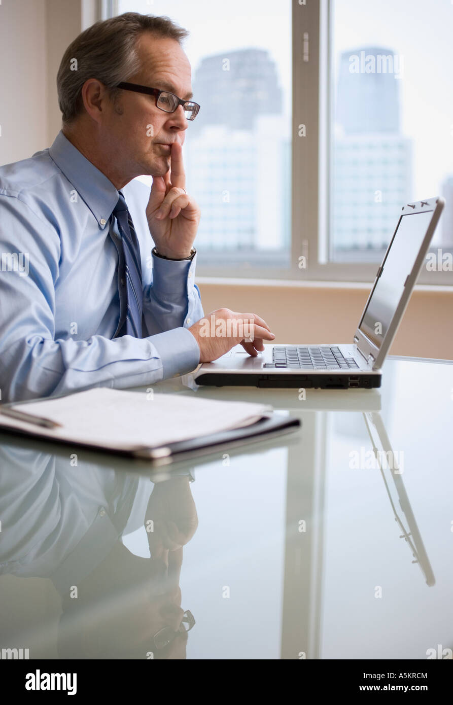 Businessman looking interest computer hi-res stock photography and ...