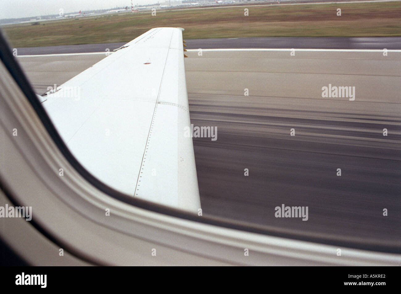 view of wing from plane window on take off Stock Photo - Alamy