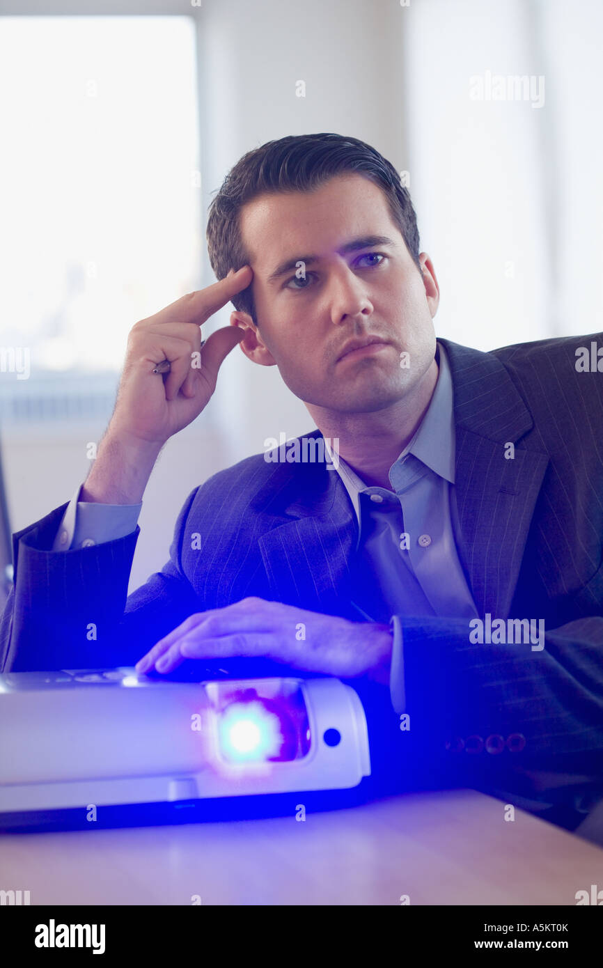 Businessman using projector in conference room Stock Photo - Alamy