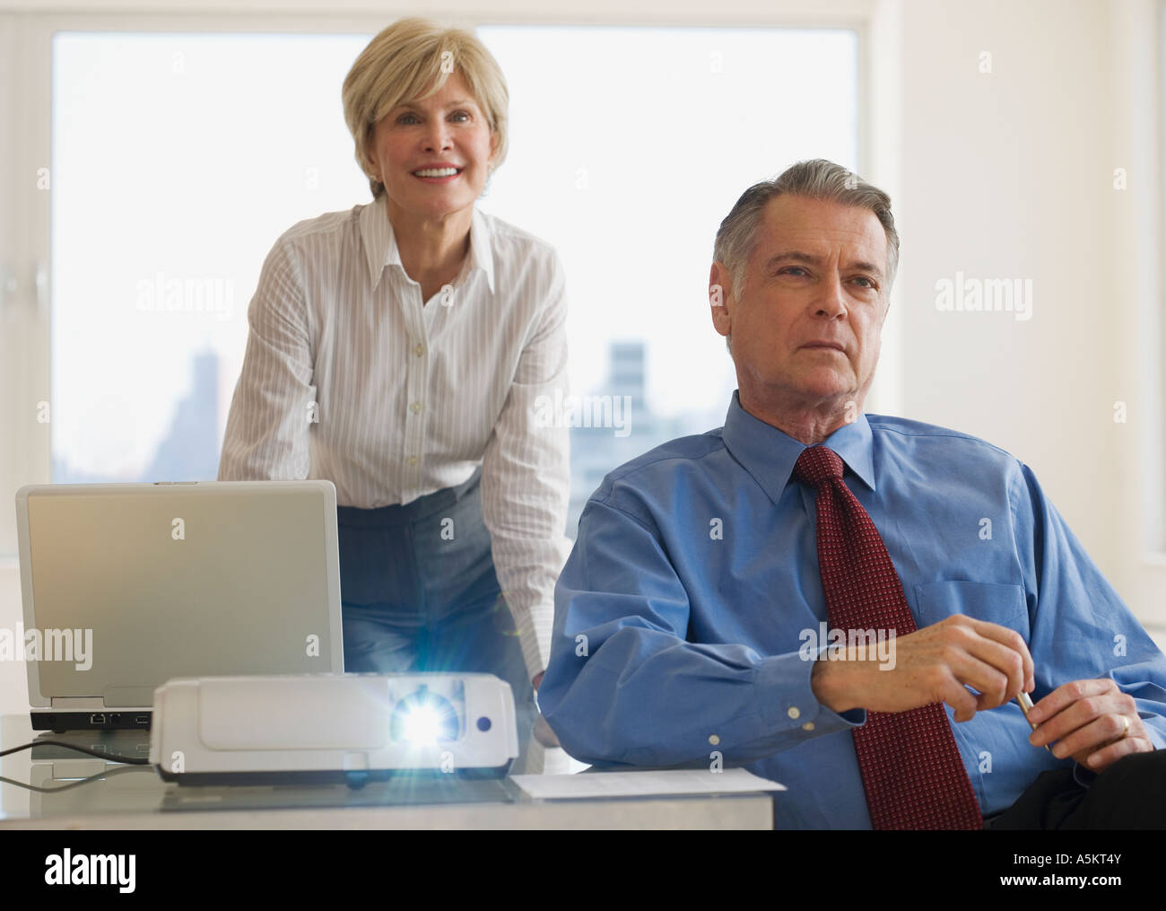 Businesswoman using projector hi-res stock photography and images - Alamy