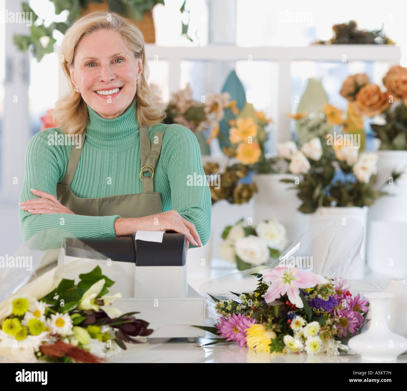 Portrait of female florist at cash register Stock Photo - Alamy