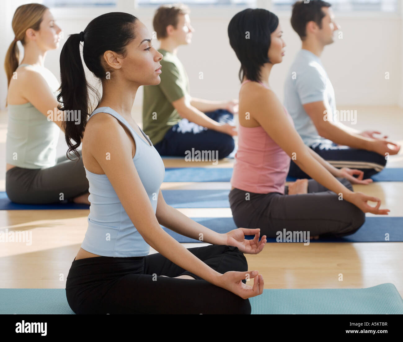 group of people practicing yoga Stock Photo - Alamy