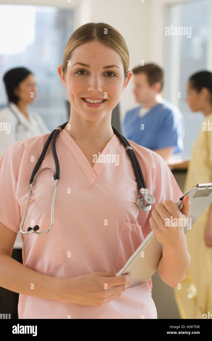 Portrait of female doctor holding medical chart Stock Photo - Alamy