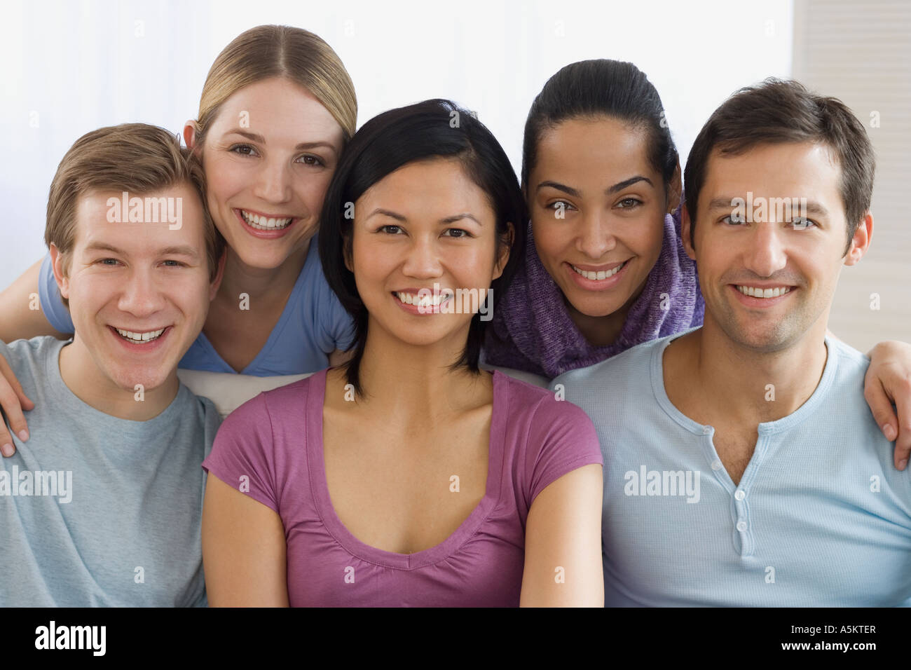 Group of friends smiling Stock Photo - Alamy