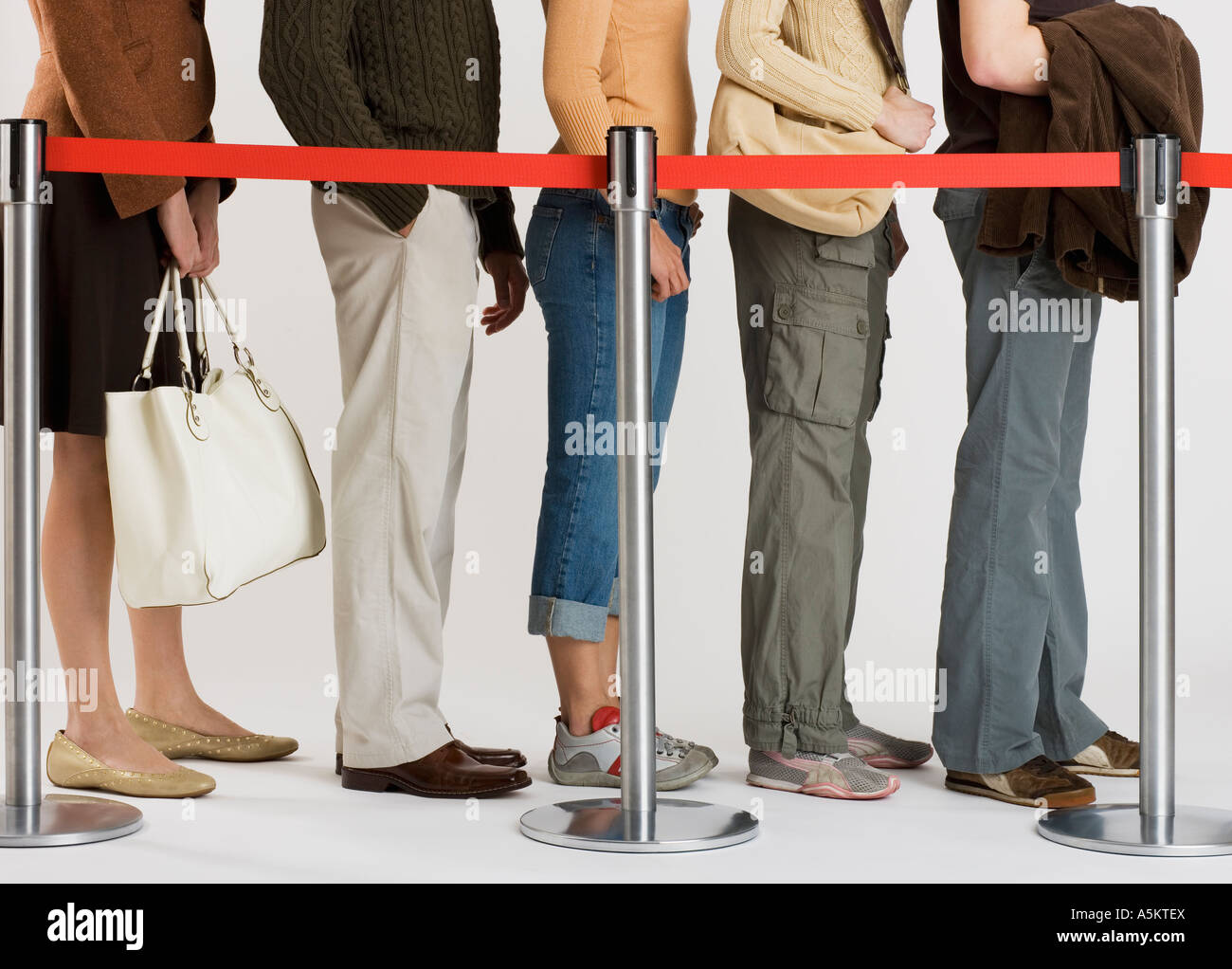 group of people standing in line Stock Photo - Alamy