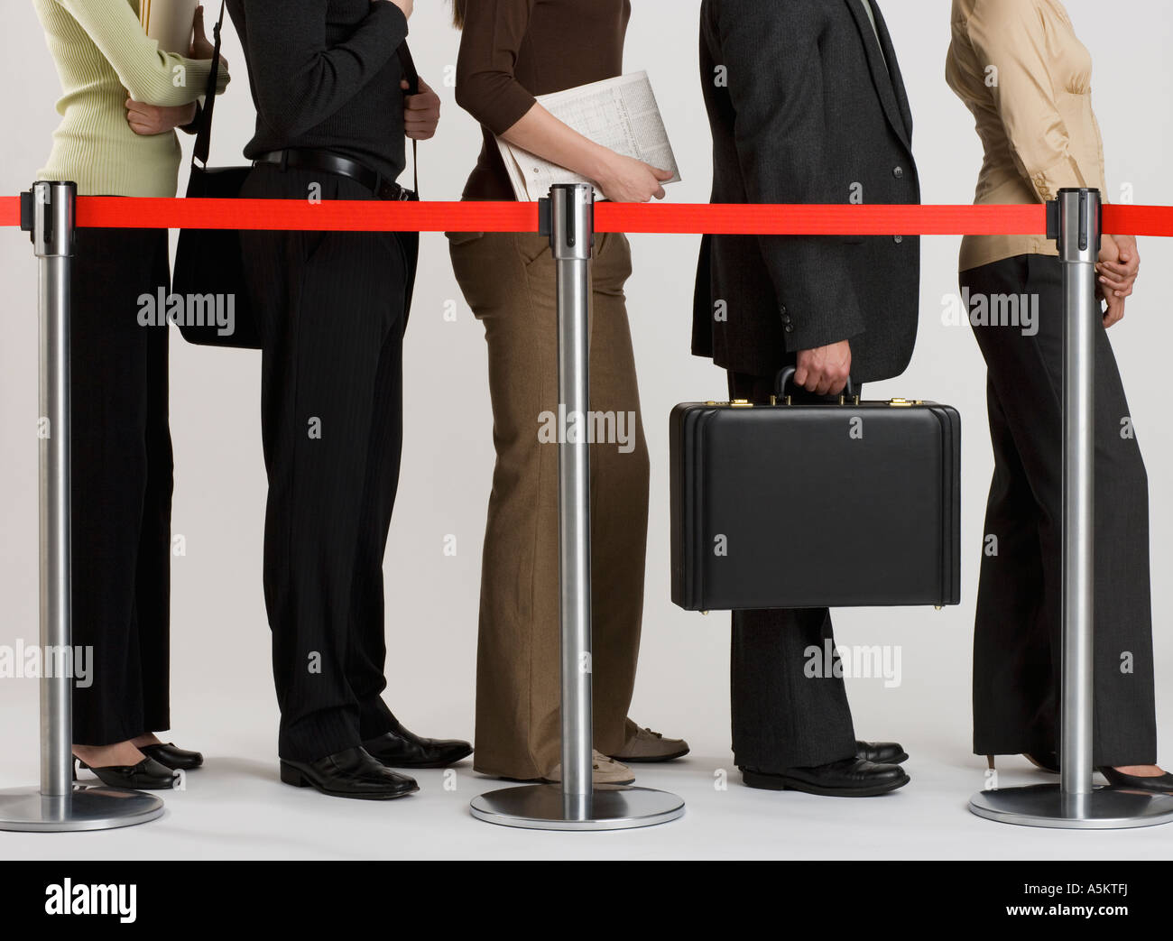 group of people standing in line Stock Photo - Alamy