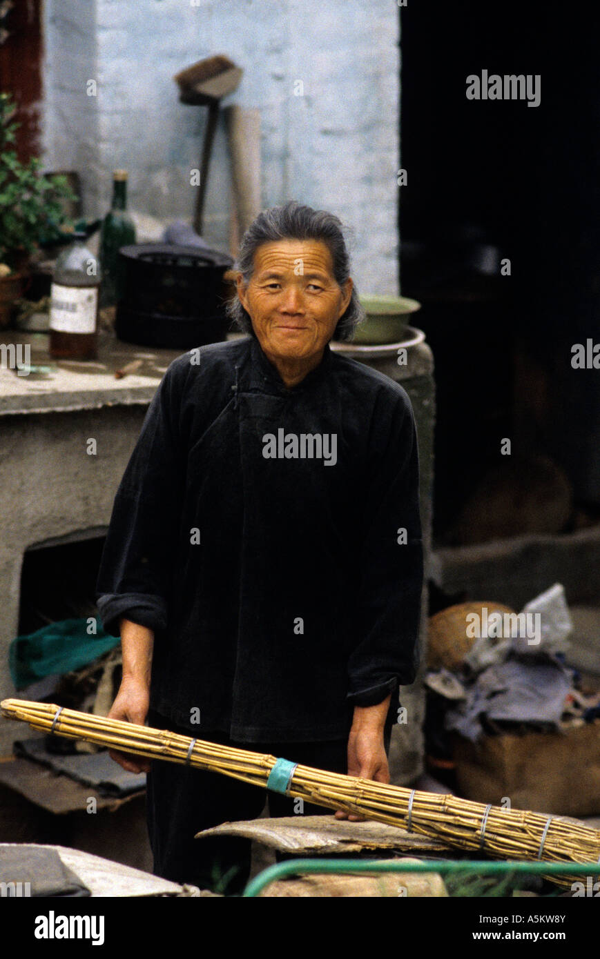 A Shanghai China peasant lady uses a bamboo straw broom and other ...