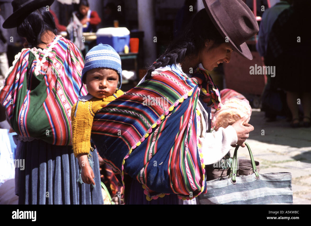 Mother carrying child in Bolivia South America Stock Photo - Alamy