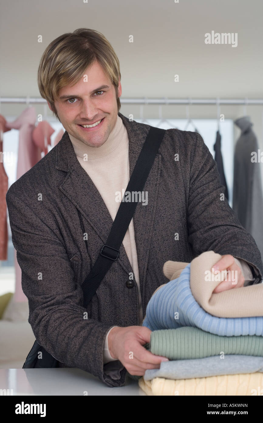 Man shopping for clothing Stock Photo - Alamy
