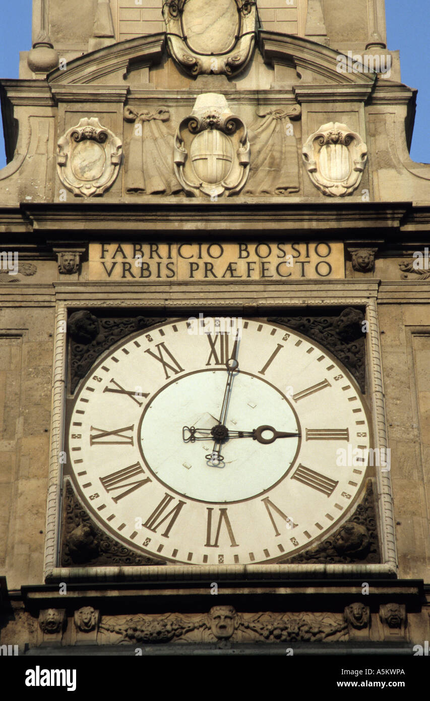 Clock and inscription on a tower, Milan, Italy Stock Photo - Alamy