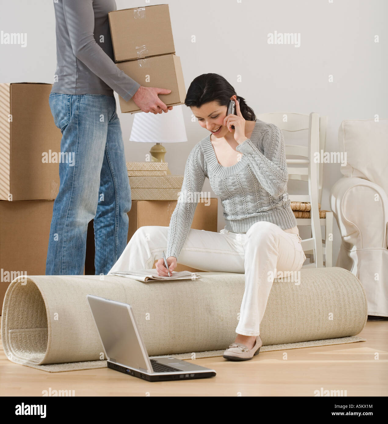 Couple setting up new house Stock Photo - Alamy